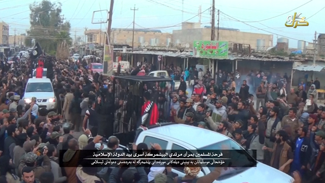 Isis: Islamic State militants parade 21 captive Peshmerga fighters in ...