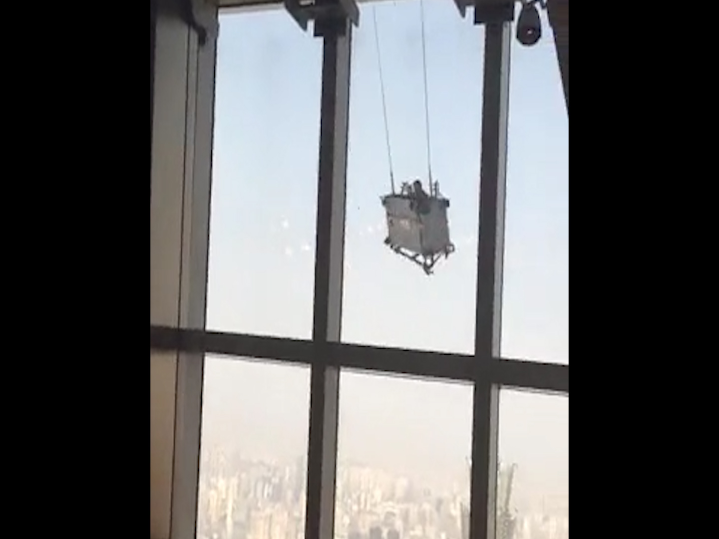 China: Video of terrifying moment strong winds slam cleaning platform ...