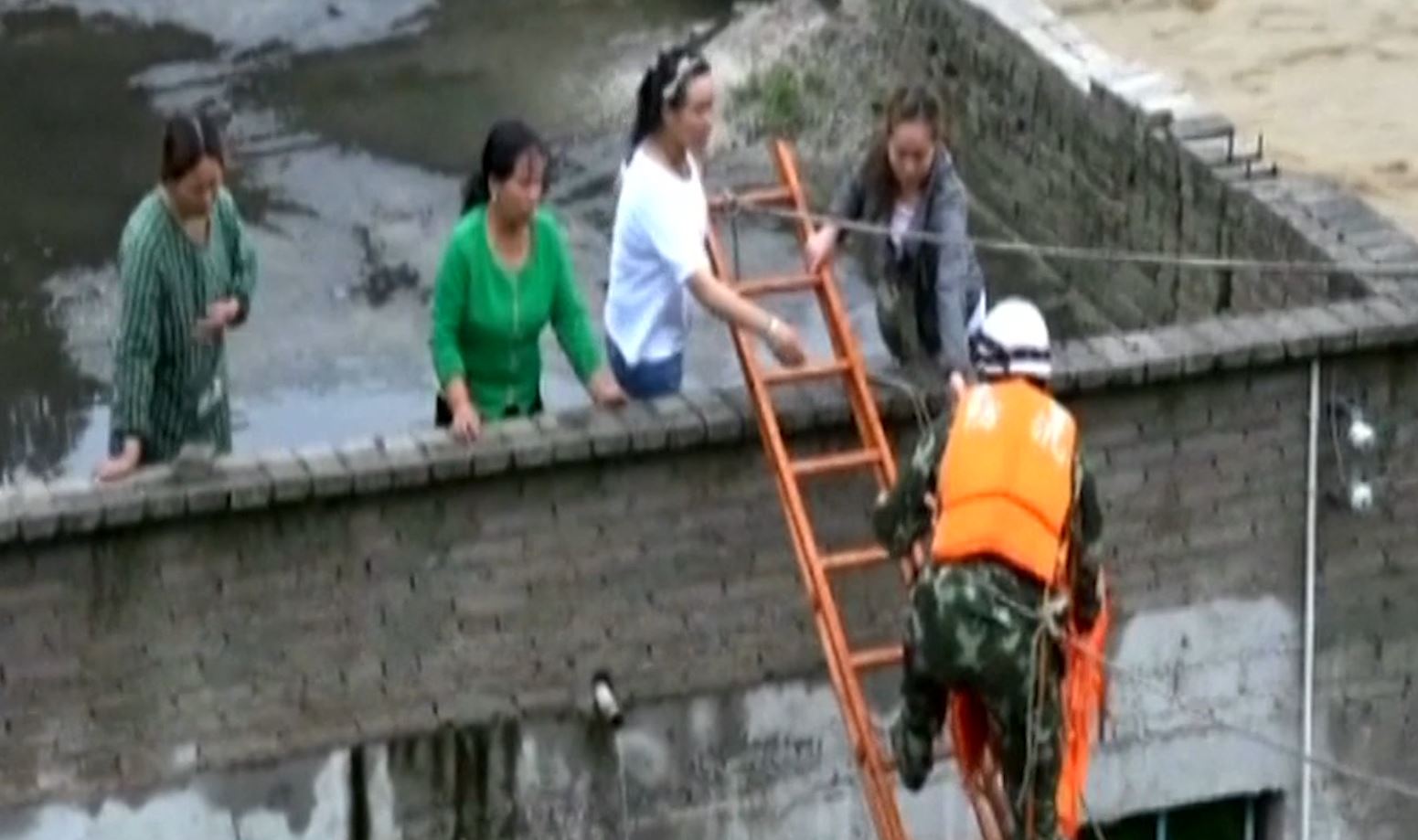 China: People evacuated after devastating floods destroy thousands of ...
