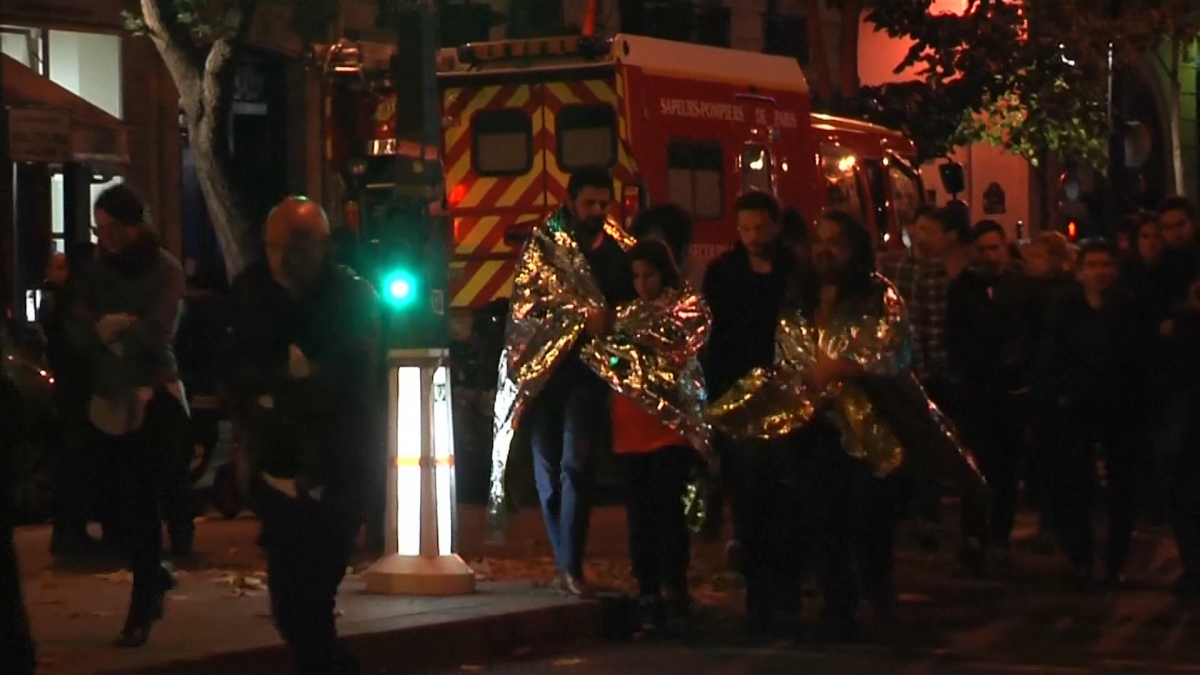 Paris attacks: Bataclan concert gunmen 'made us lie down, kept shooting ...