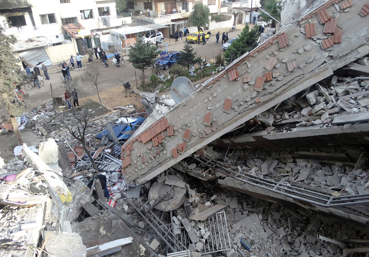 Syria: Shattered city of Homs returns to Assad control as fighters ...