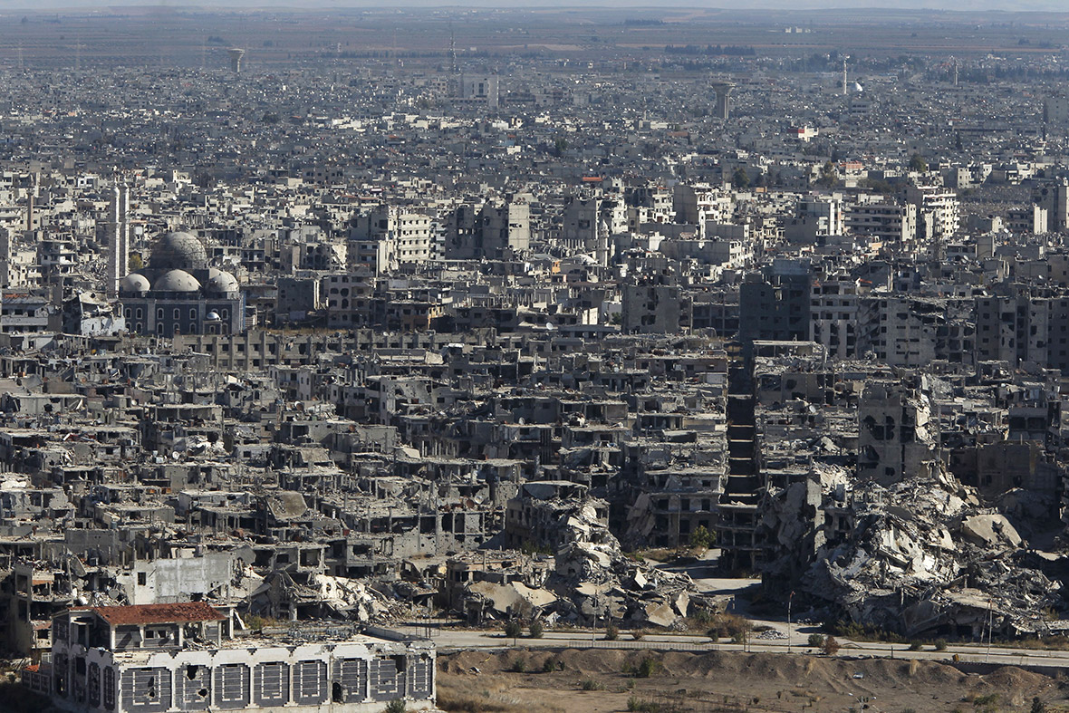 Syria: Shattered city of Homs returns to Assad control as fighters ...