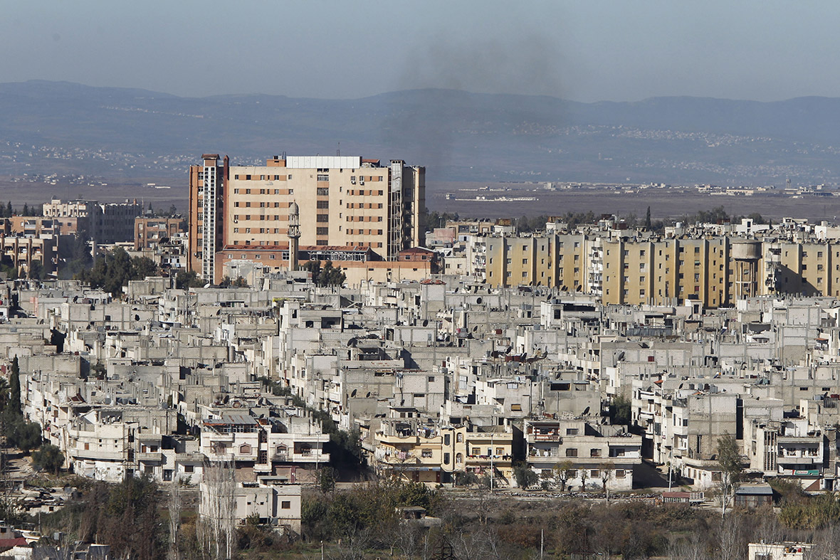 Syria: Shattered city of Homs returns to Assad control as fighters ...