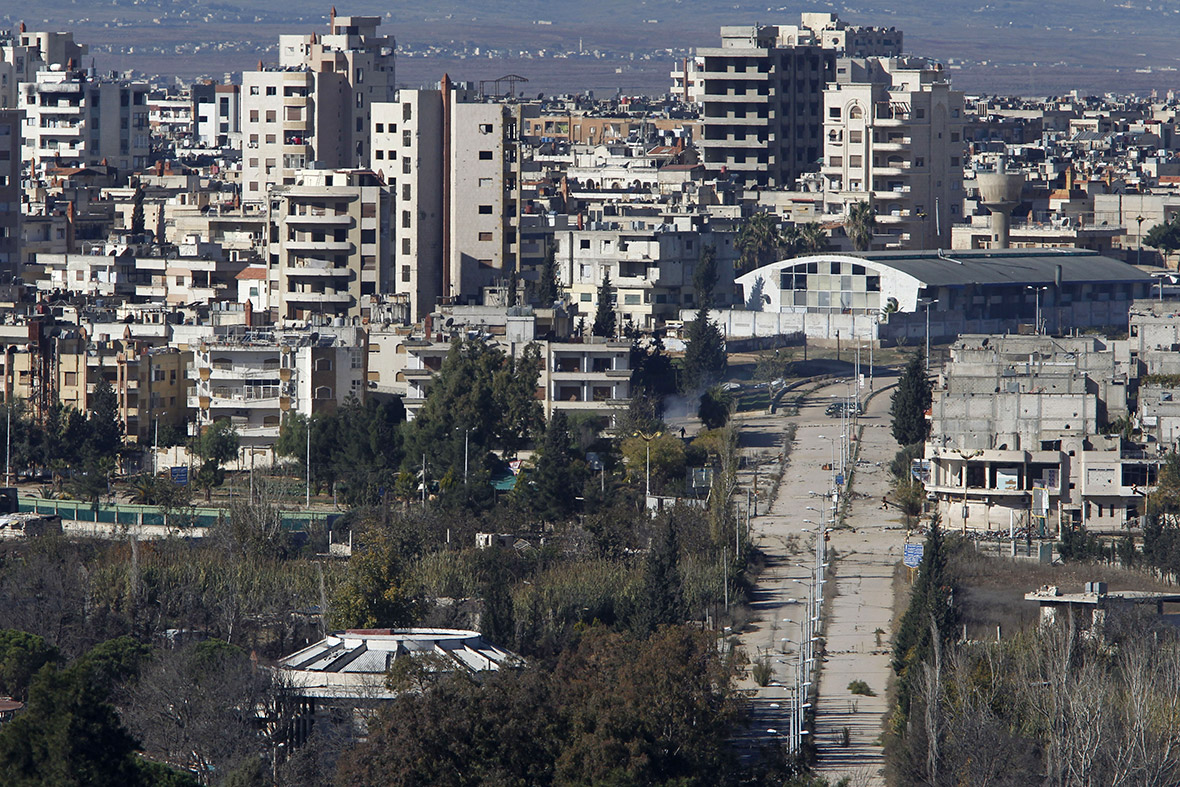 Syria: Shattered city of Homs returns to Assad control as fighters ...