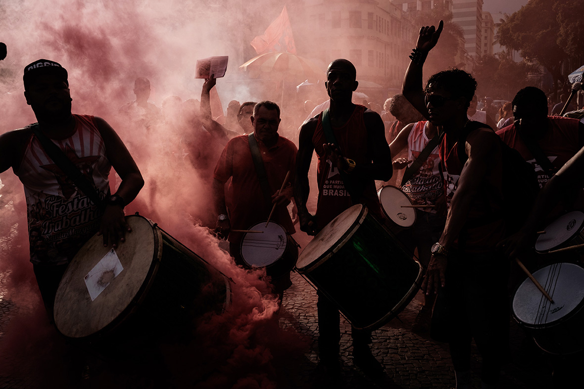 Brazil: Demonstrators fill streets with red smoke in support of ...