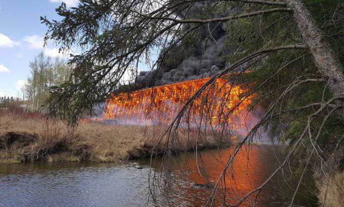Canada: Aerial footage captures burning railway bridge in Alberta ...