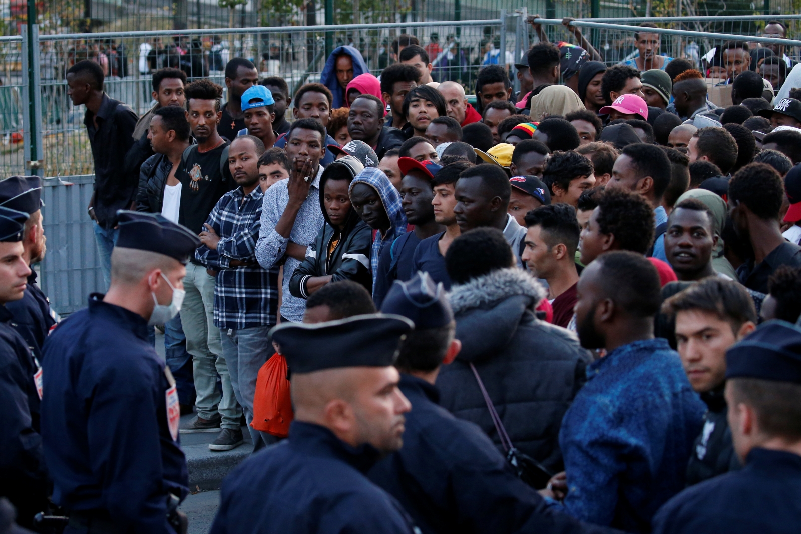 Thousands of refugees and migrants evicted from Paris sidewalks by French police