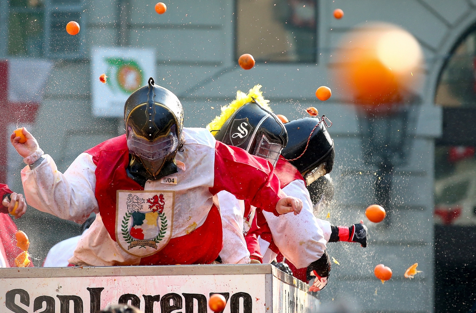 Giant food fight as thousands throw fruit in medieval Battle of the Oranges